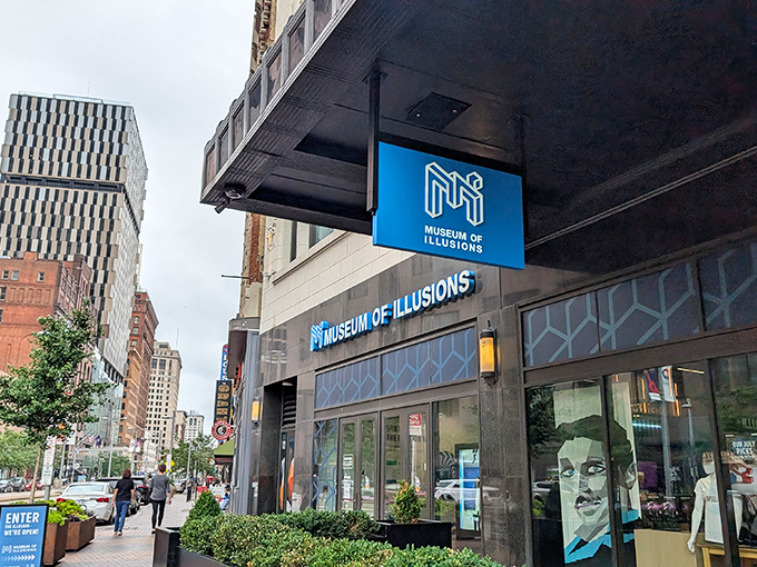 Nestled among Cleveland's urban landscape, the Museum of Illusions stands out with its distinctive blue signage and geometric patterns that hint at the visual trickery within.