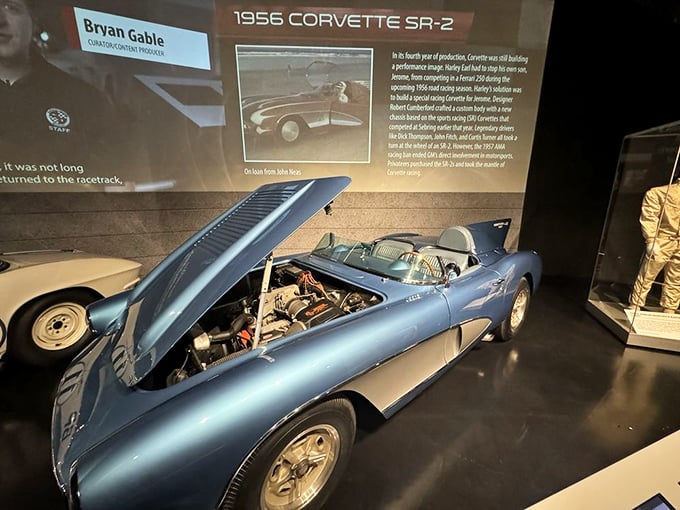 The 1956 SR-2 with its hood up reveals the engineering magic beneath the beautiful blue exterior&mdash;like peeking behind a magician's curtain.