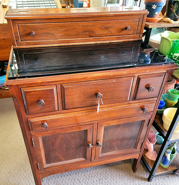 Craftsmanship that puts modern furniture to shame. This cabinet has survived longer than most marriages and still looks this good.