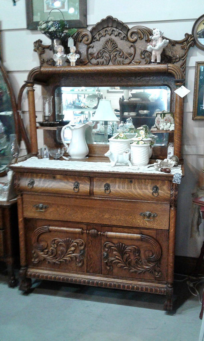 This ornate oak sideboard with beveled mirror has witnessed more family dinners than Thanksgiving at your grandmother's house.