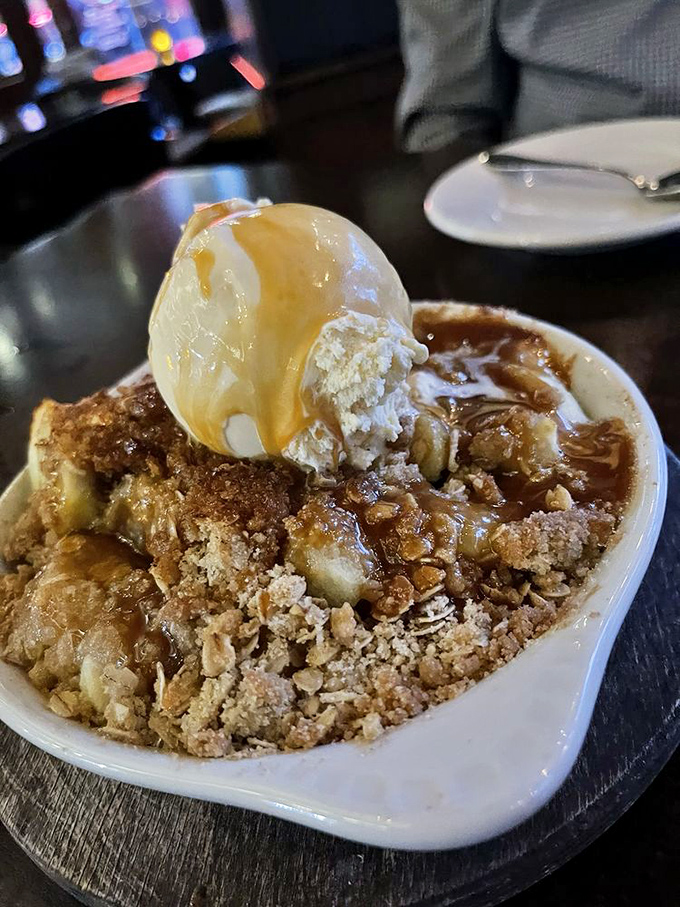 Grandma Marilyn's apple crisp with ice cream melting into warm cinnamon-scented apples&mdash;dessert that demands you loosen your belt.