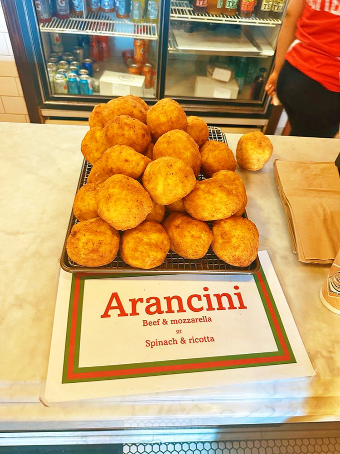 Golden arancini balls fresh from the fryer, crispy outside and creamy inside, proof that rice deserves respect.