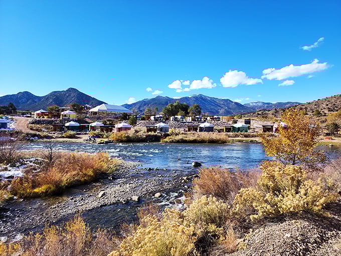 The Arkansas River winds through town like a liquid postcard, surrounded by homes that won the real estate lottery for best backyard views.