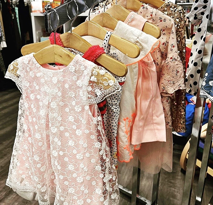 Delicate baby dresses hang like tiny works of art. Someone's special occasion outfit becomes another family's heirloom, the circle of thrift continuing.