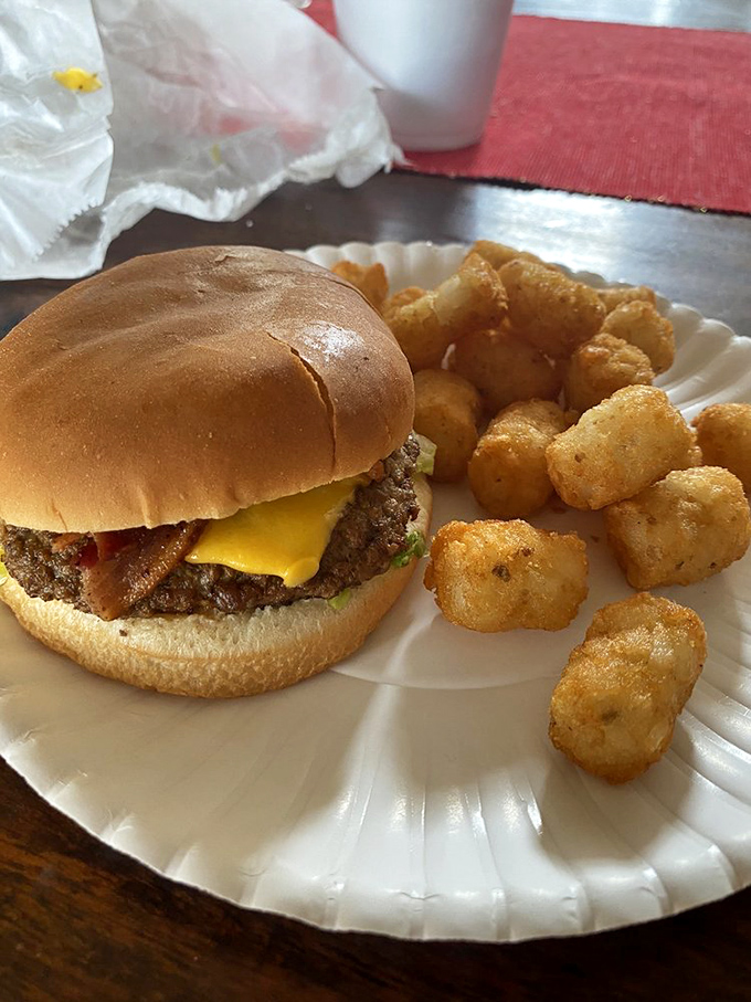 The classic bacon cheeseburger with golden tater tots – a combo that's brought more joy to humanity than most Nobel Prize winners.