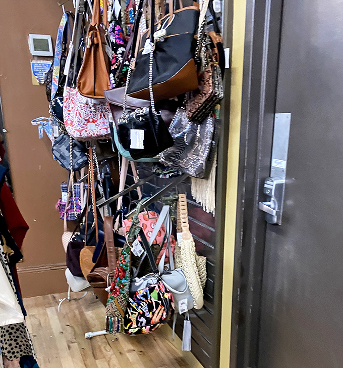 Bag paradise where purses hang like exotic fruit, each one waiting for the right shoulder to call home.