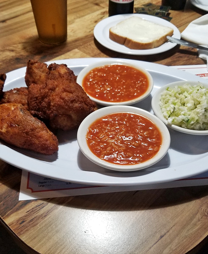 Fried chicken flanked by beans and slaw&mdash;the holy trinity of comfort food. This plate doesn't just feed your body; it nourishes something deeper.