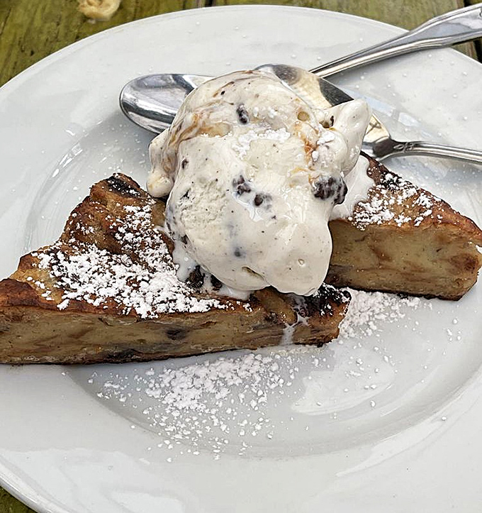 Dessert that makes you consider ordering a second one before you've finished the first – warm, comforting, and topped with ice cream melting into sweet surrender.
