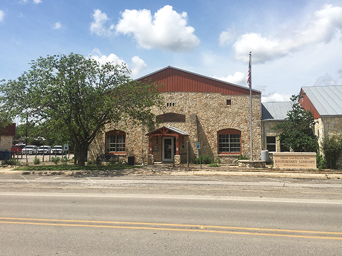 The Kronkosky Library's rustic stone facade houses adventures bound in pages, proving Bandera's stories extend far beyond what happens on horseback.