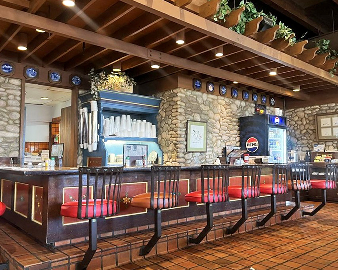 The counter seating area offers prime people-watching with a side of nostalgia. Those red stools have supported decades of happy diners.