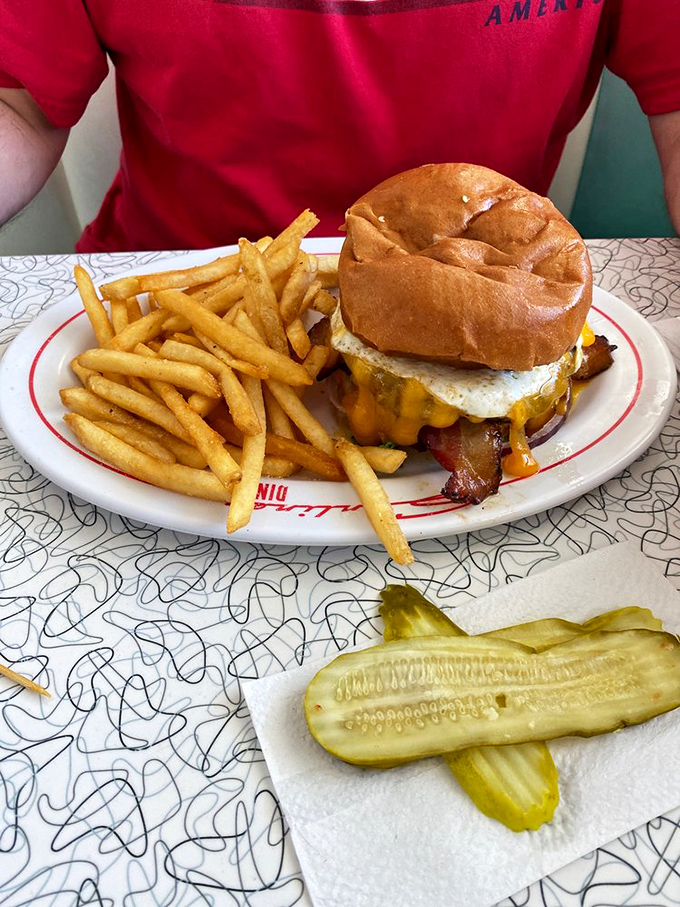 This isn't just a burger&mdash;it's an architectural achievement with bacon, cheese, and egg stacked so perfectly it deserves its own blueprint.