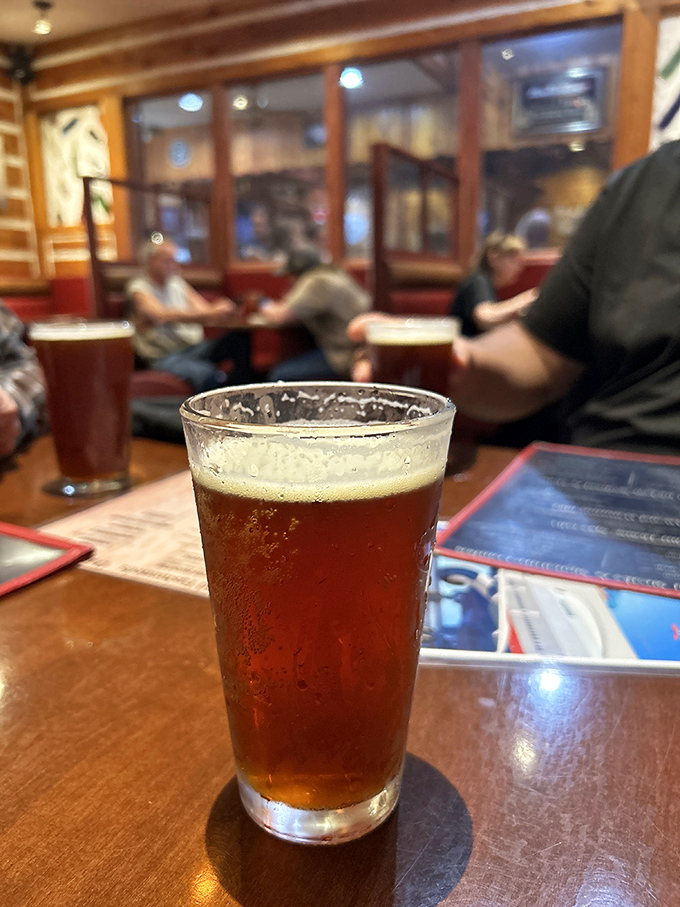 A perfectly poured craft beer catching the light just right. The ideal companion for contemplating your next carnivorous conquest.