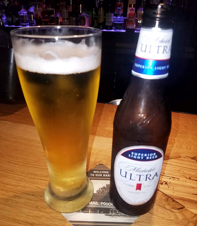 Cold beer in proper glassware&mdash;because civilization exists even in barn restaurants. The condensation says "drink me now."