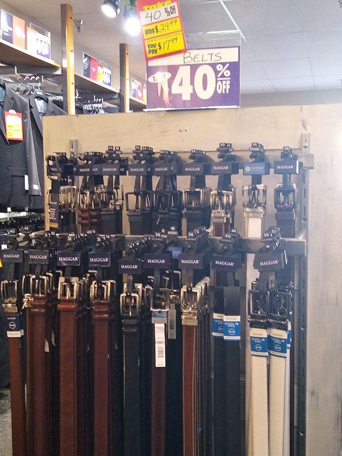 Haggar belts hanging in formation &ndash; because nothing says "I've got my life together" like a good belt at 40% below department store prices.