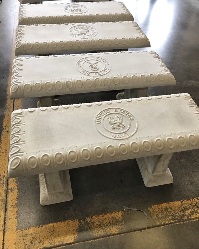 Military pride cast in concrete. These benches tell stories of service while offering weary shoppers a moment's respite. 