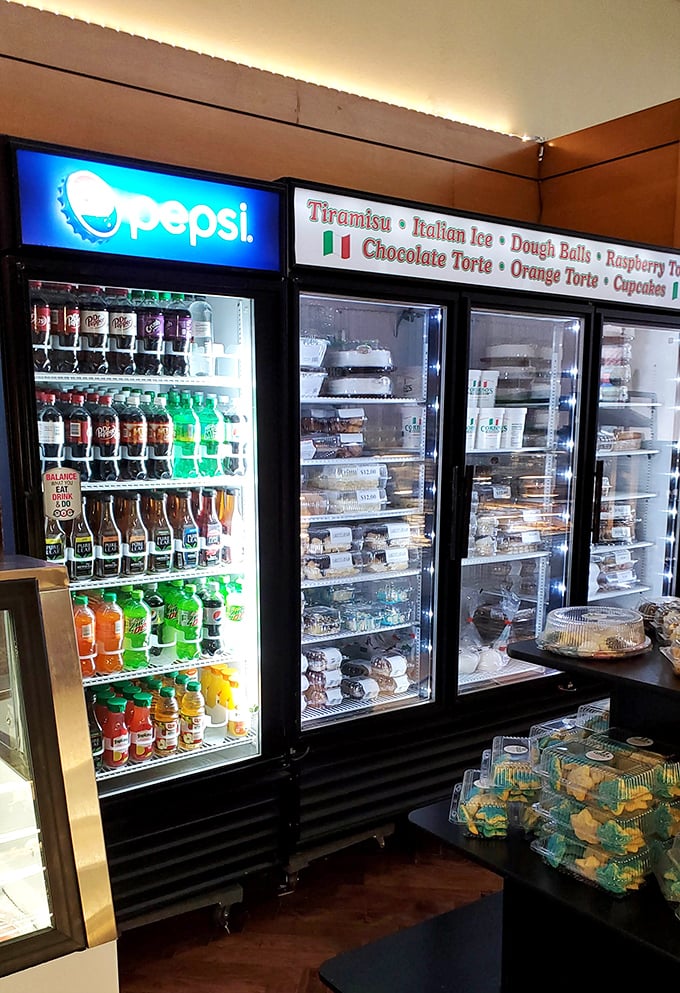 Dessert display that requires willpower of superhero proportions. Those tiramisu containers are practically whispering your name from behind the glass.