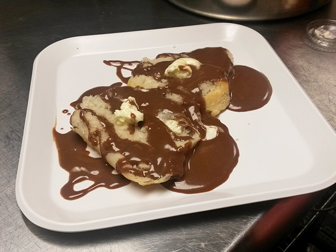 Biscuits swimming in chocolate gravy&mdash;proof that sometimes the most unlikely combinations create the most unforgettable flavors.