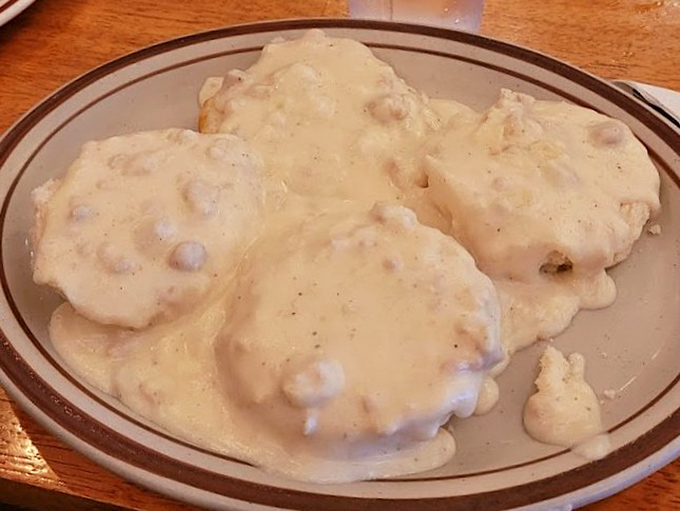 Biscuits and gravy that could settle family feuds. The pepper-speckled country gravy blankets fresh-baked biscuits like the first snow of winter.
