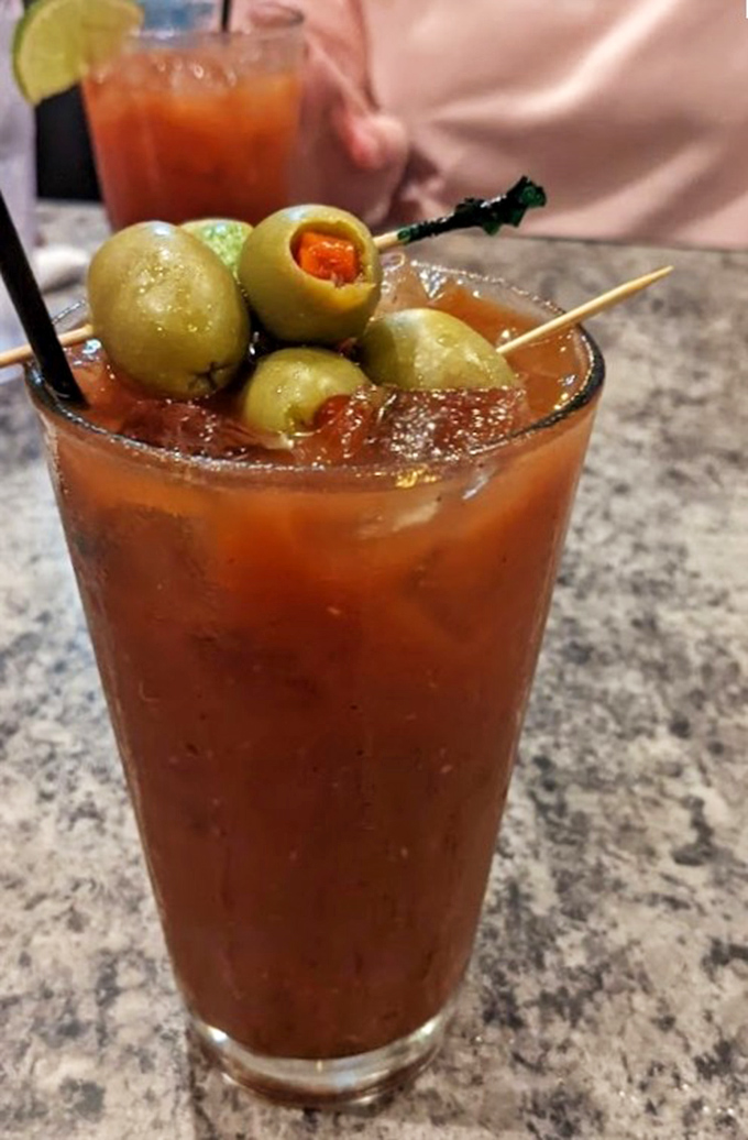This Bloody Mary isn't just a drink, it's an entire appetizer course&mdash;those olives are practically doing a synchronized swimming routine in tomato glory.