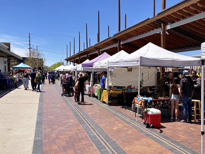 The outdoor market stretches along brick pathways, creating a gauntlet of temptation where empty shopping bags don't stand a chance.