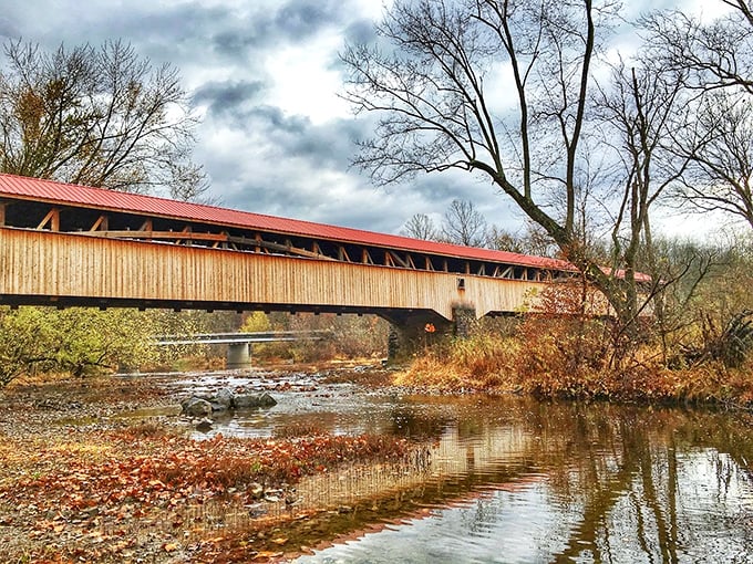 Autumn transforms the bridge into a painting. Those rust-colored leaves are nature's way of complementing the bridge's weathered red roof.
