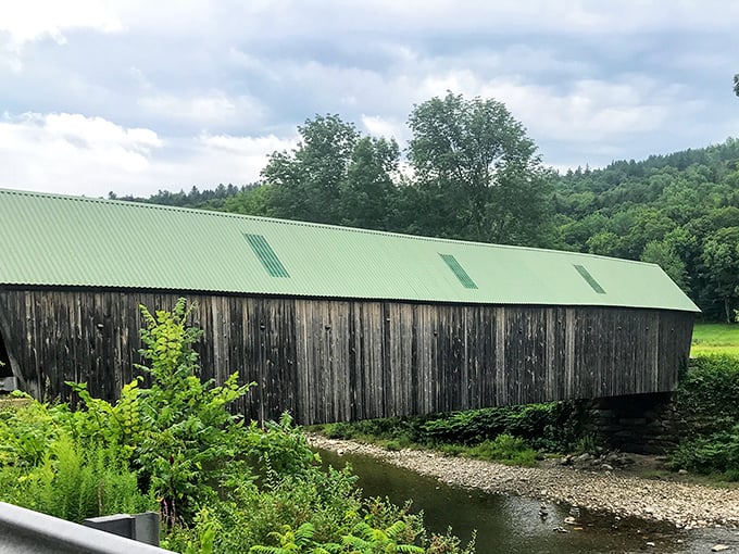 The green metal roof adds a splash of color against weathered wood, protecting this historic treasure from New Hampshire's notorious elements.