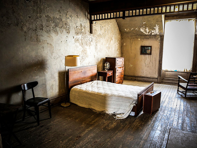 The warden's quarters offer a stark contrast to prison cells. This bedroom's faded elegance whispers of privilege amid an ocean of deprivation.