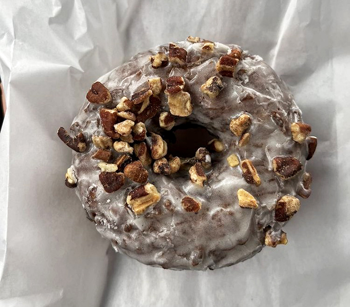 This butter pecan donut isn't messing around – serious glaze, serious nuts, serious commitment to making your day better.
