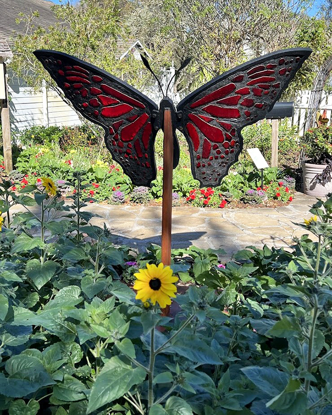 Not your average garden ornament—this butterfly sculpture transforms flowers into an art gallery where the admission is just your attention.