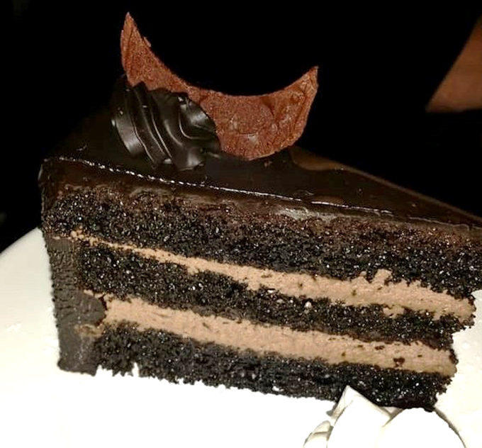 A chocolate layer cake that doesn't mess around. Three layers of dark chocolate decadence that demands to be savored slowly.