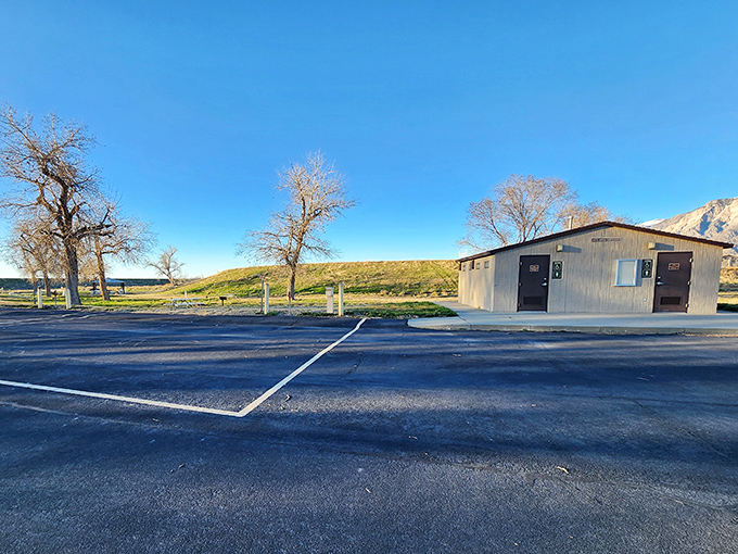 Even the facilities have a view! This humble restroom building has witnessed more "emergency" pit stops and swimsuit changes than a roadside diner.