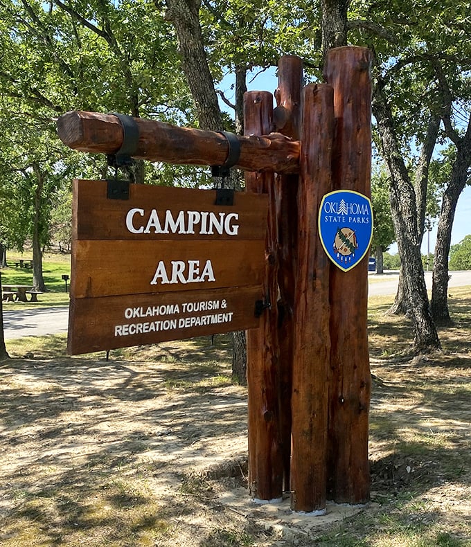 The gateway to outdoor slumber parties. This sign marks the boundary between civilization and where marshmallows meet their delicious, golden-brown fate.