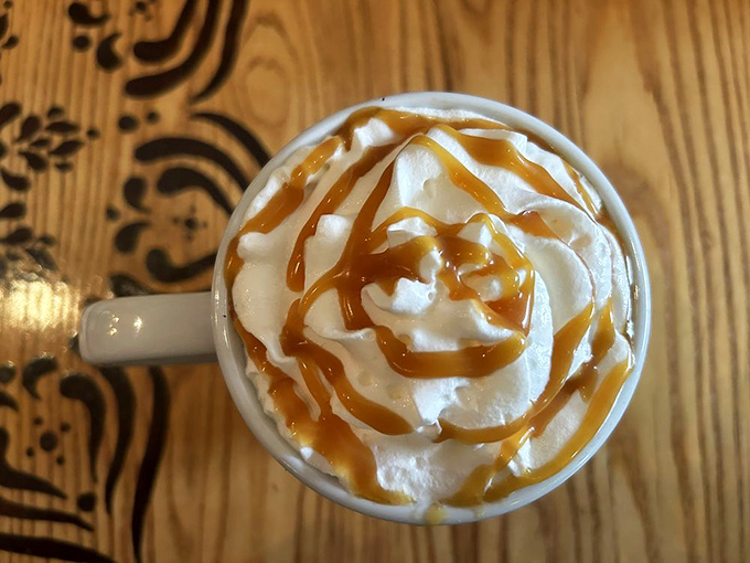 This isn't just coffee, it's liquid therapy - topped with cloud-like whipped cream and caramel drizzle that forms a hypnotic spiral.