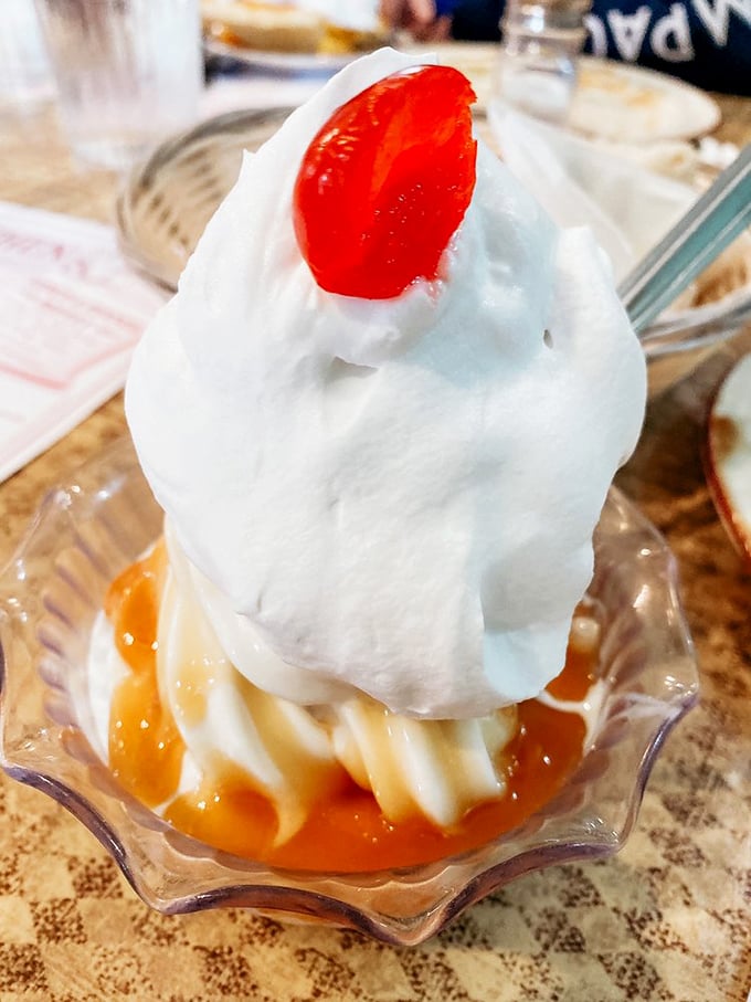 That caramel sundae is basically happiness in a glass dish, topped with a cherry of pure nostalgia.