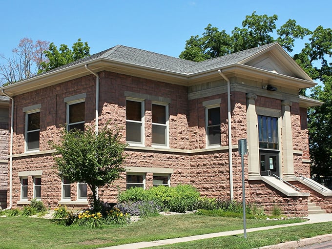 The Carnegie Library stands as a pink quartzite tribute to knowledge and community gathering spaces that endure.