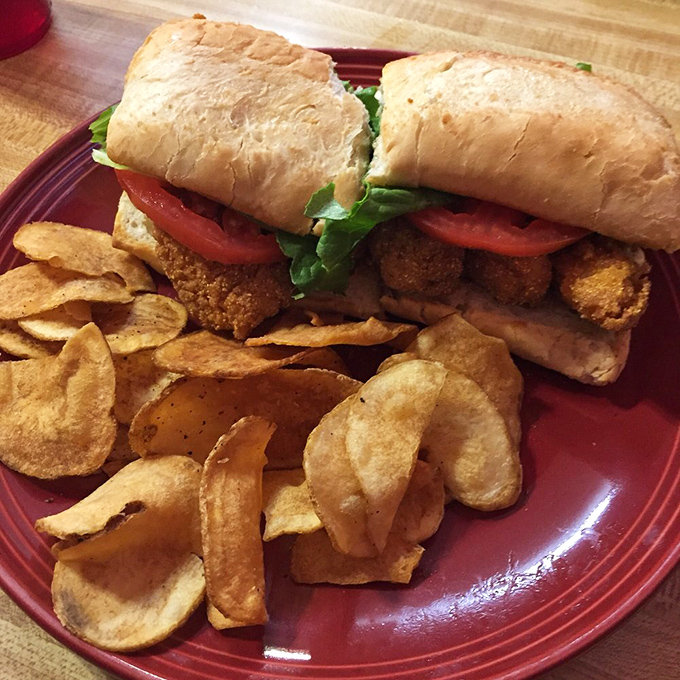 The catfish po'boy: where cornmeal-crusted fish meets fresh veggies in a sandwich that would make New Orleans jealous.