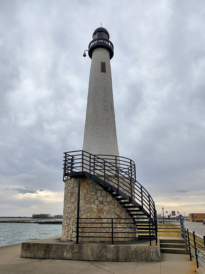 The lighthouse stands sentinel over Grand Lake St. Marys, a beacon that's witnessed countless sunsets and first kisses since its construction.