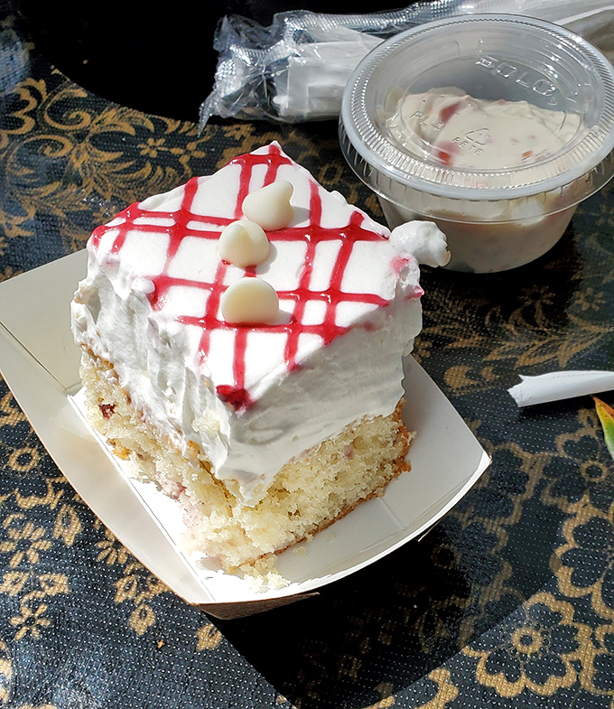 Dessert that demands a moment of silence. This white cake with raspberry drizzle isn't just a sweet ending&mdash;it's the reason elastic waistbands were invented.