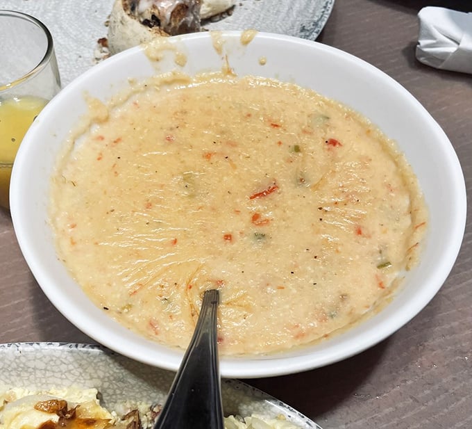 Cheesy grits so smooth and velvety they make silk pajamas feel like sandpaper. Pure Southern comfort in a bowl.