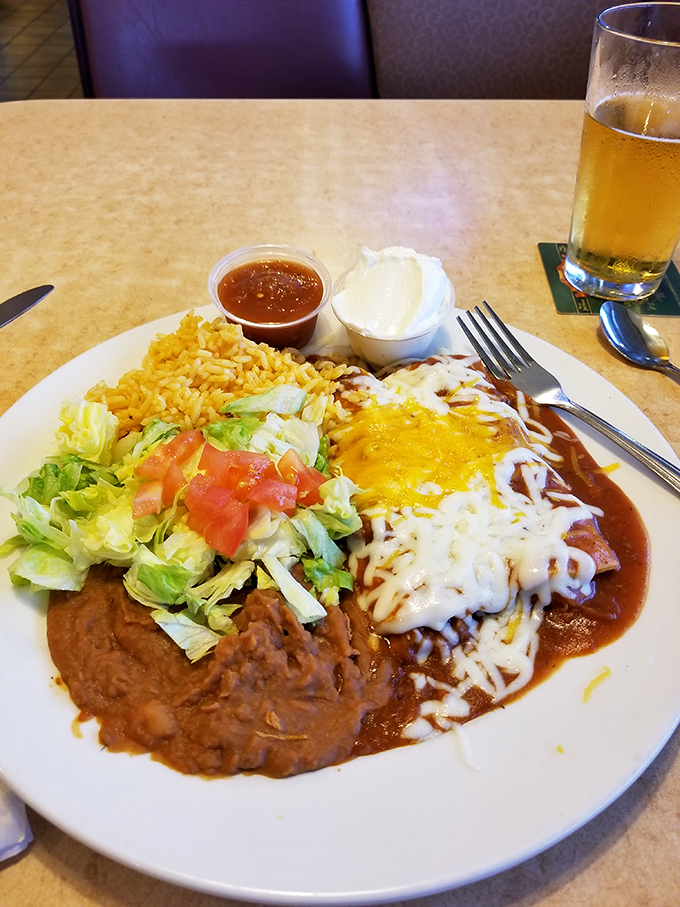 A fiesta on a plate where enchiladas swim in rich sauce under a blanket of melted cheese&mdash;no passport required for this flavor trip.