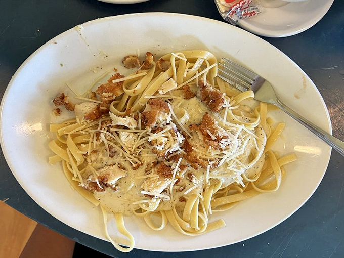 Fettuccine that makes you forget your name. Tender pasta swimming in creamy sauce with perfectly seasoned chicken &ndash; comfort food that hugs your soul.