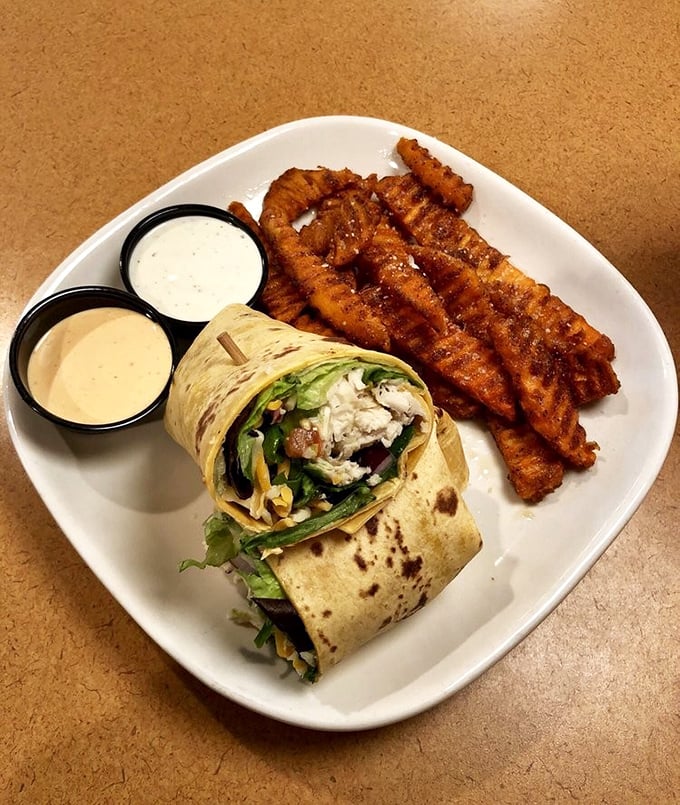 The perfect wrap doesn't exi— Oh wait, here it is, with those crispy sweet potato fries standing guard like delicious sentinels.