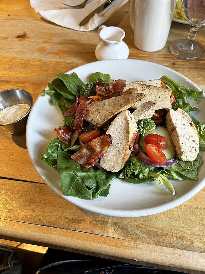 A salad that meat-lovers won't mock. Fresh greens playing host to perfectly cooked chicken, bacon, and vegetables that actually taste like vegetables should.