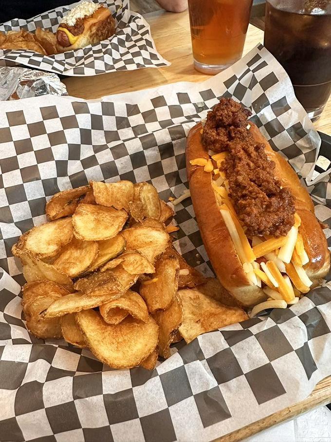 The chili dog &ndash; America's most democratic food &ndash; dressed for success with cheese and perfectly balanced toppings. No fancy credentials required.