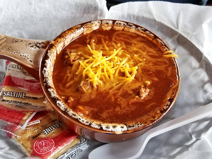 Chili that looks like it's been simmering since the railroad's golden age, topped with cheese that melts like your resistance to ordering dessert.