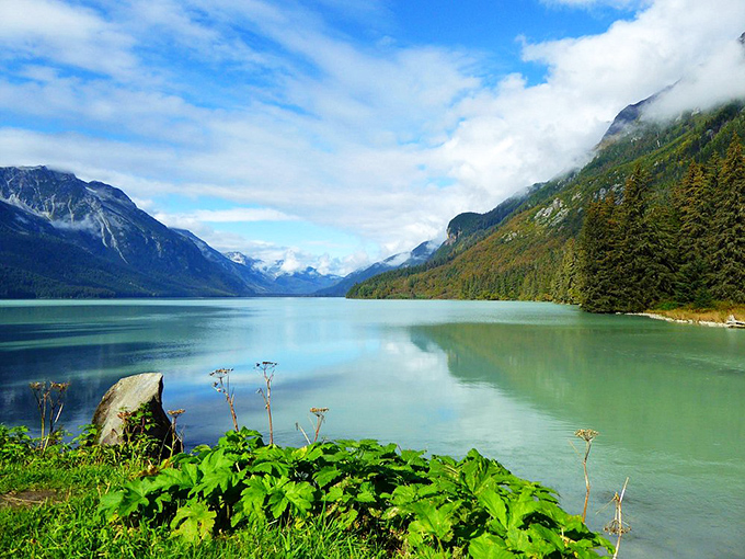 Chilkoot River's turquoise waters reflect mountains so perfectly, you'll wonder which way is up. Nature showing off again.