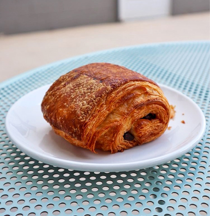 This chocolate croissant doesn't just flake&mdash;it shatters into buttery shards that make you understand why people line up at dawn.