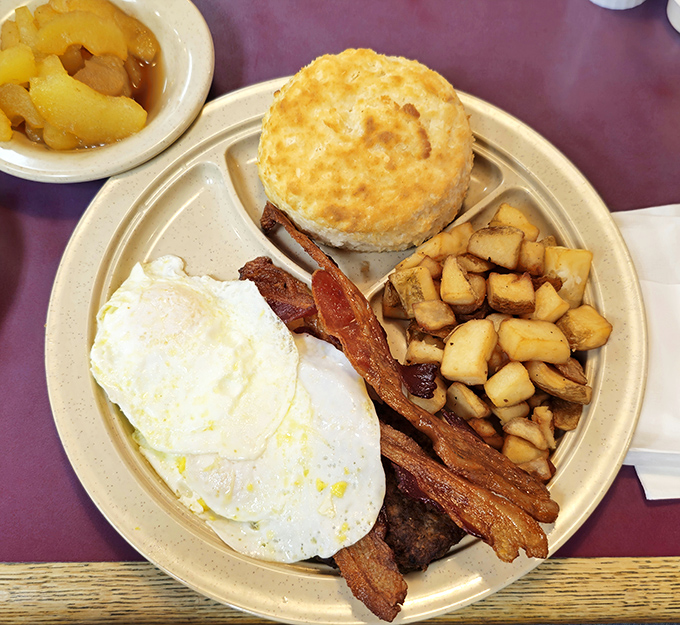 The breakfast plate that launched a thousand road trips&mdash;eggs, bacon, potatoes, and that golden biscuit stealing the spotlight.