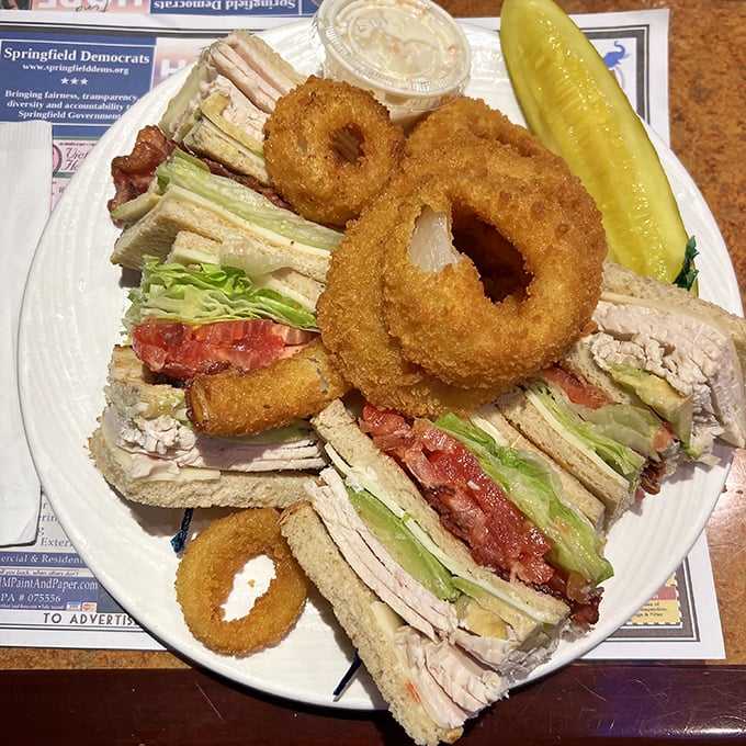 The club sandwich that requires a game plan just to figure out how to take the first bite&mdash;architectural achievement between bread slices.
