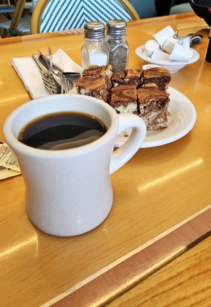 Coffee and black and white cookies &ndash; the perfect finale to your deli experience. One sip, one bite, pure contentment. 